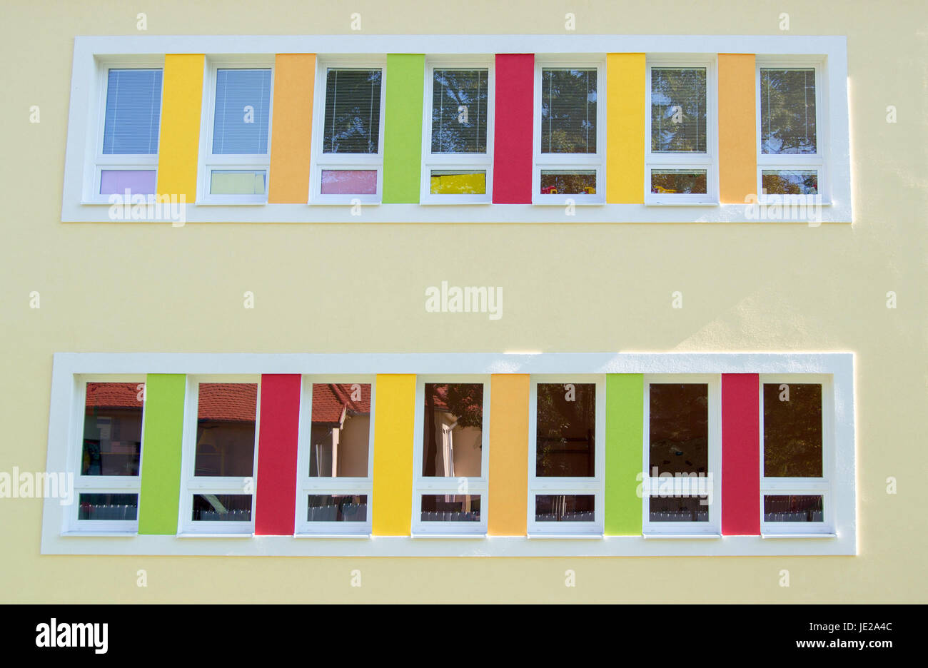 Colorful windows on school building Stock Photo - Alamy