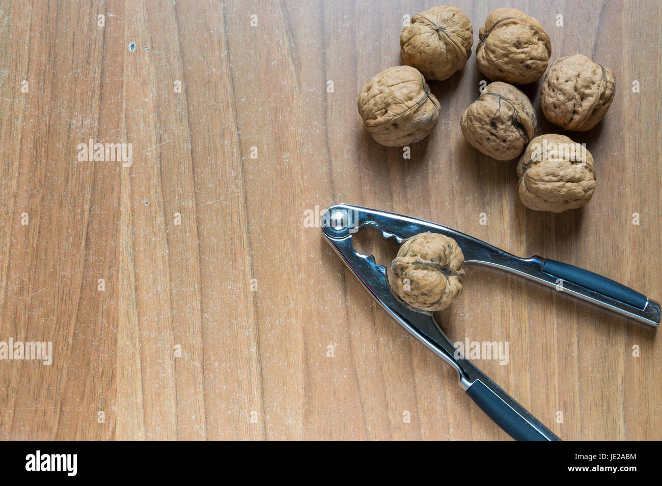 Set of some nuts and a nutcracker Stock Photo - Alamy