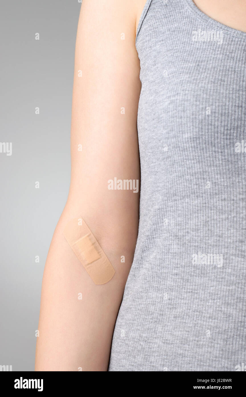 Female arm with adhesive bandage Stock Photo - Alamy