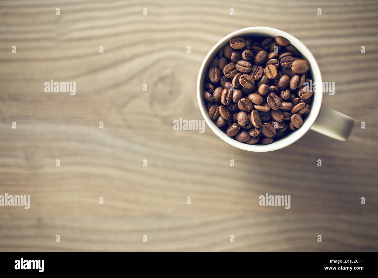 top view of coffee beans in mug Stock Photo - Alamy