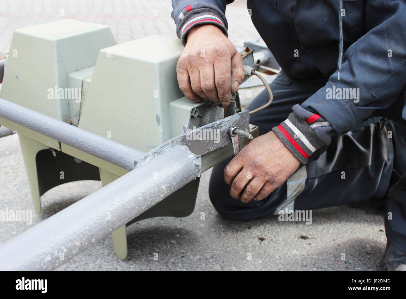 The worker replaces the broken traffic light with a working traffic ...