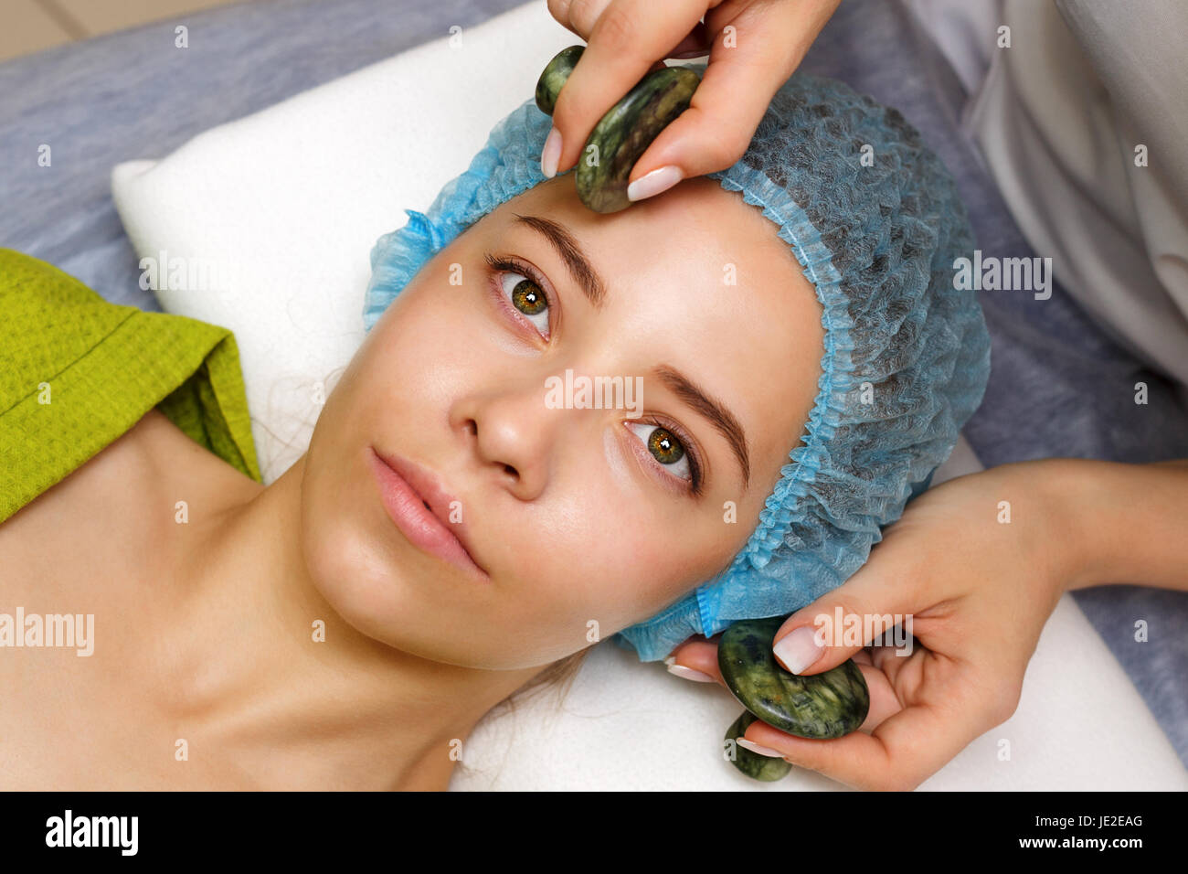 Woman having forehead massage hi-res stock photography and images - Alamy