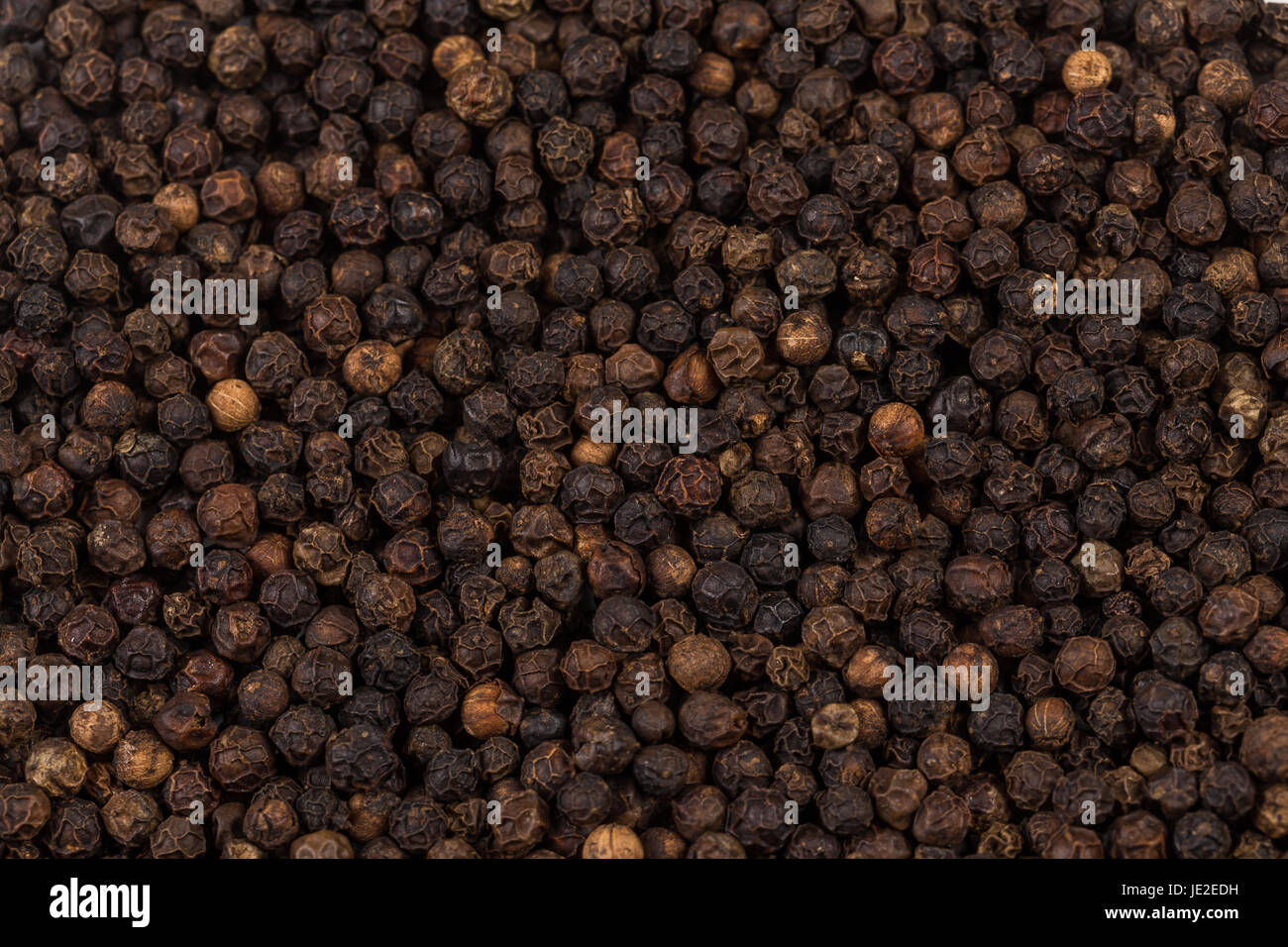Black pepper zoomed in on and close up texture Stock Photo - Alamy