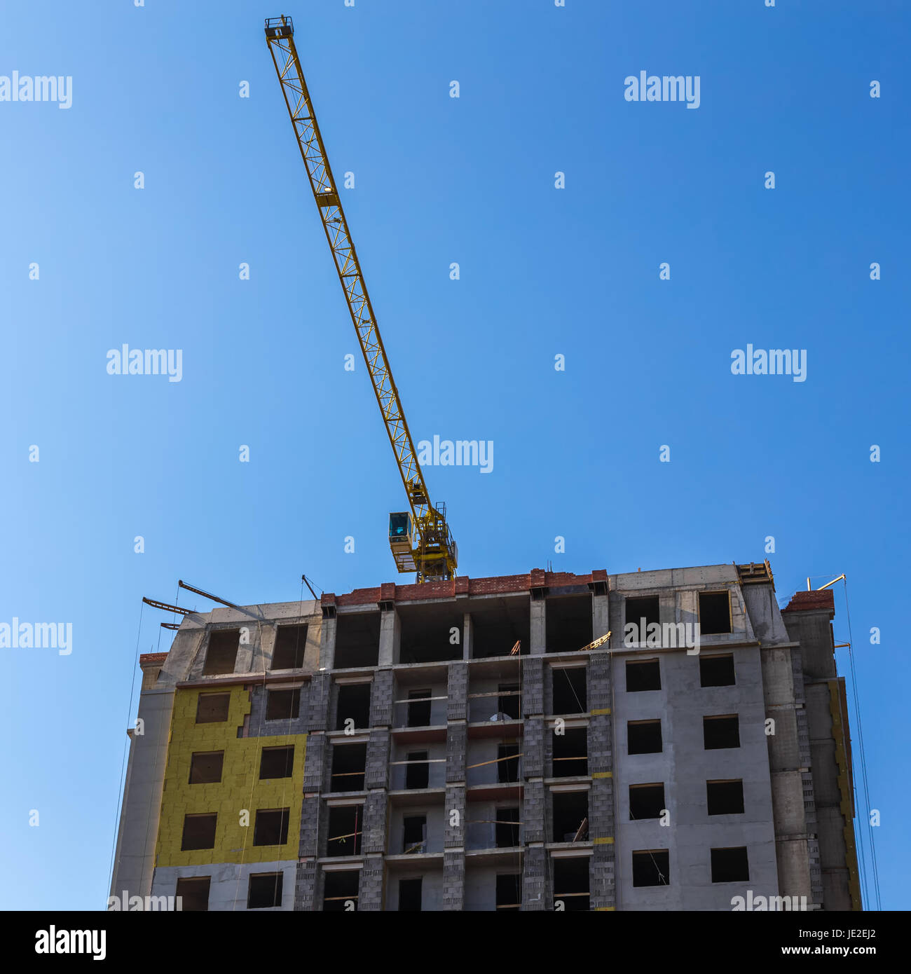 Construction crane on building site on sky background Stock Photo - Alamy