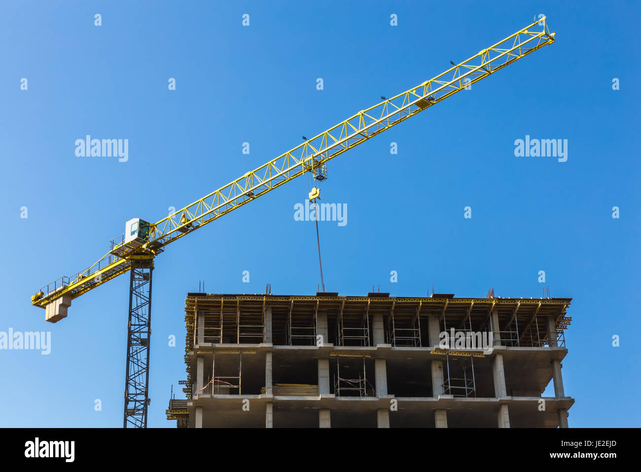 Construction crane on building site on sky background Stock Photo - Alamy