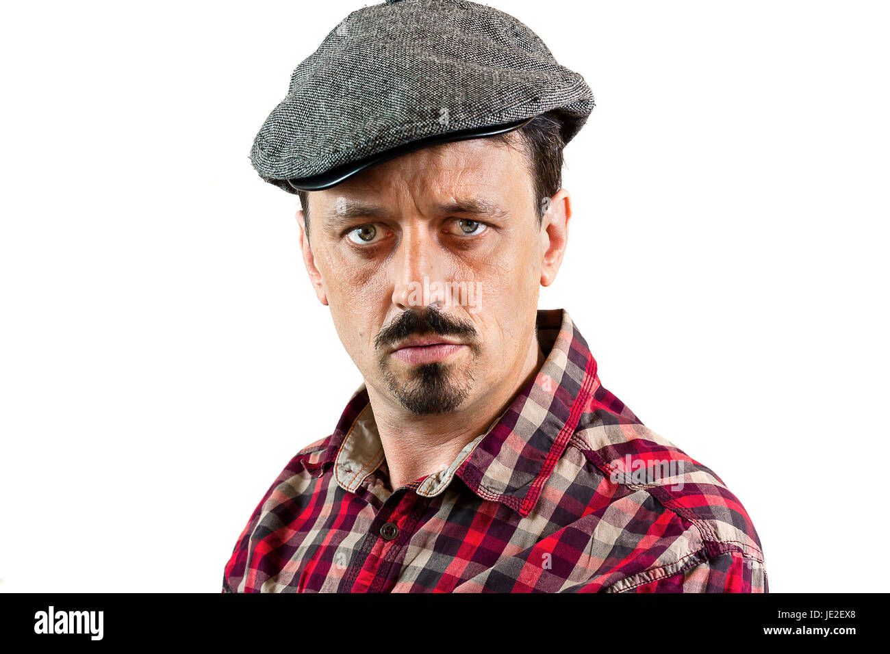 Portrait in Profile of young man wearing a cap, isolated on white ...