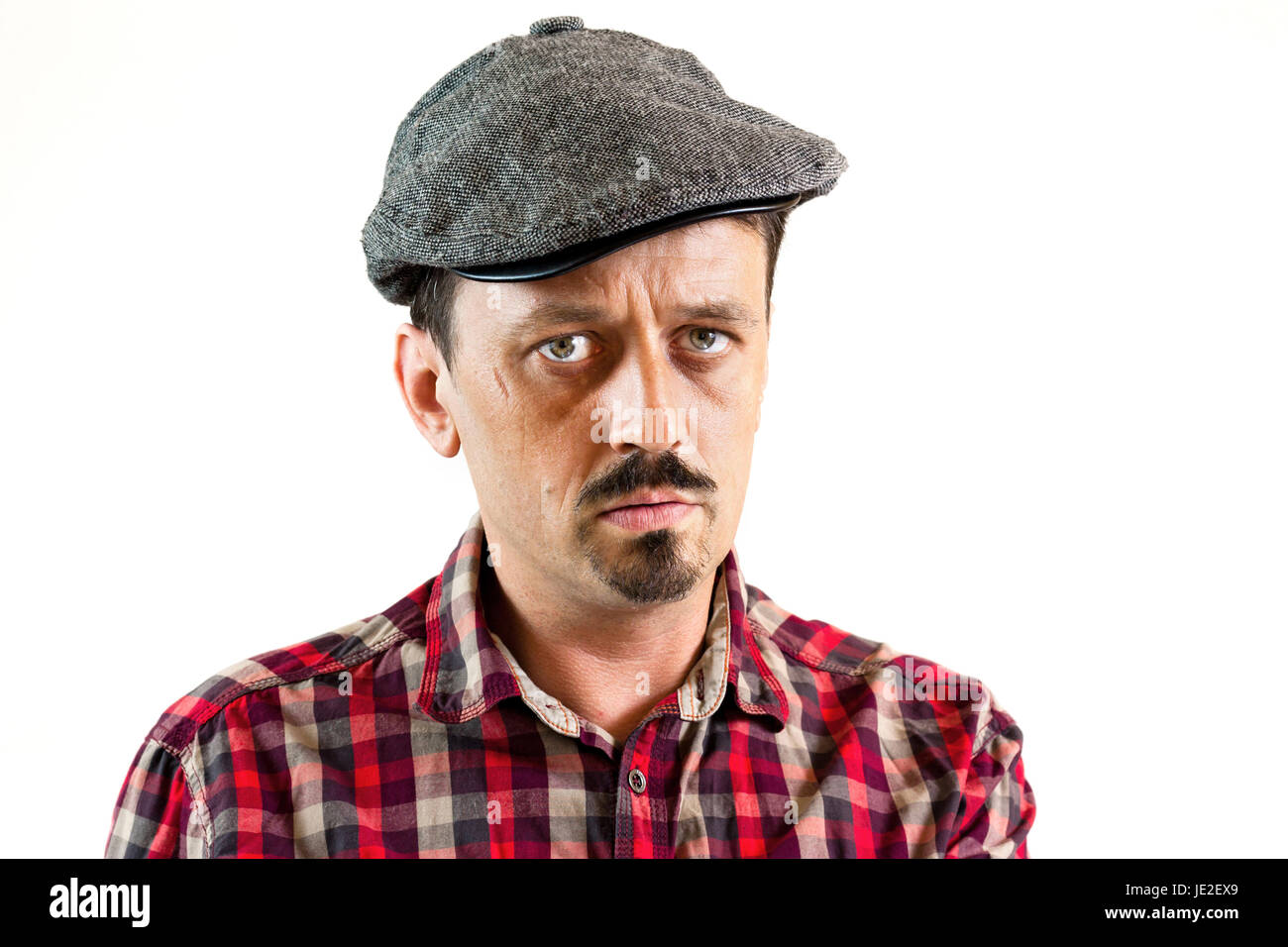 Closeup portrait of a young man man wearing a cap, isolated on white ...