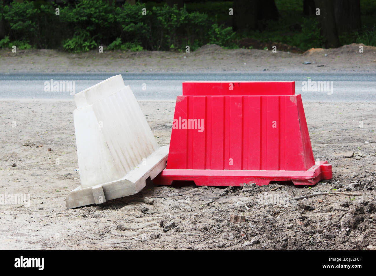 Red and white plastic barriers blocking the road Stock Photo - Alamy