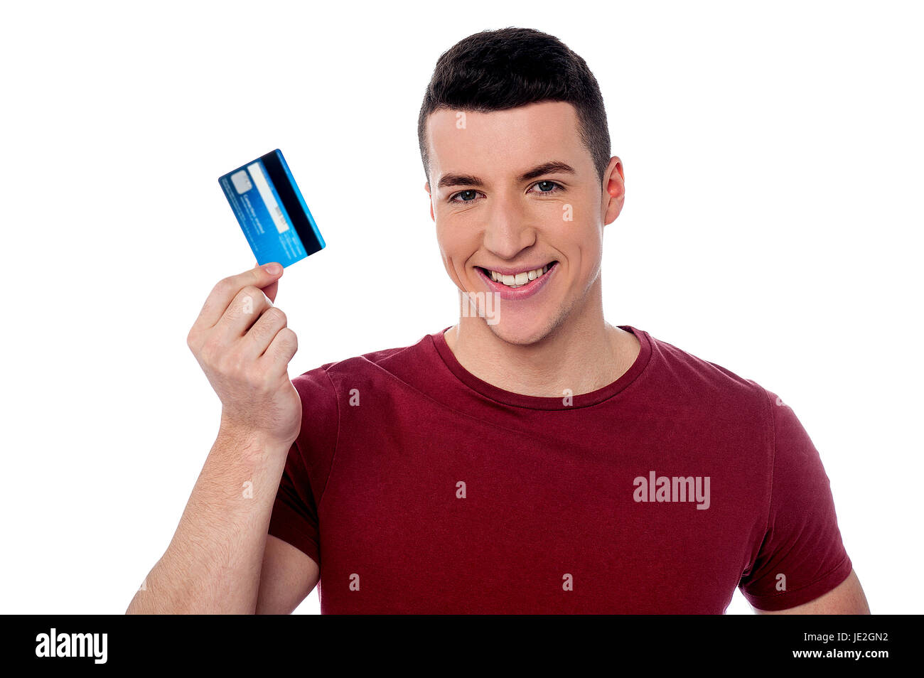 Handsome man showing his debit card Stock Photo - Alamy