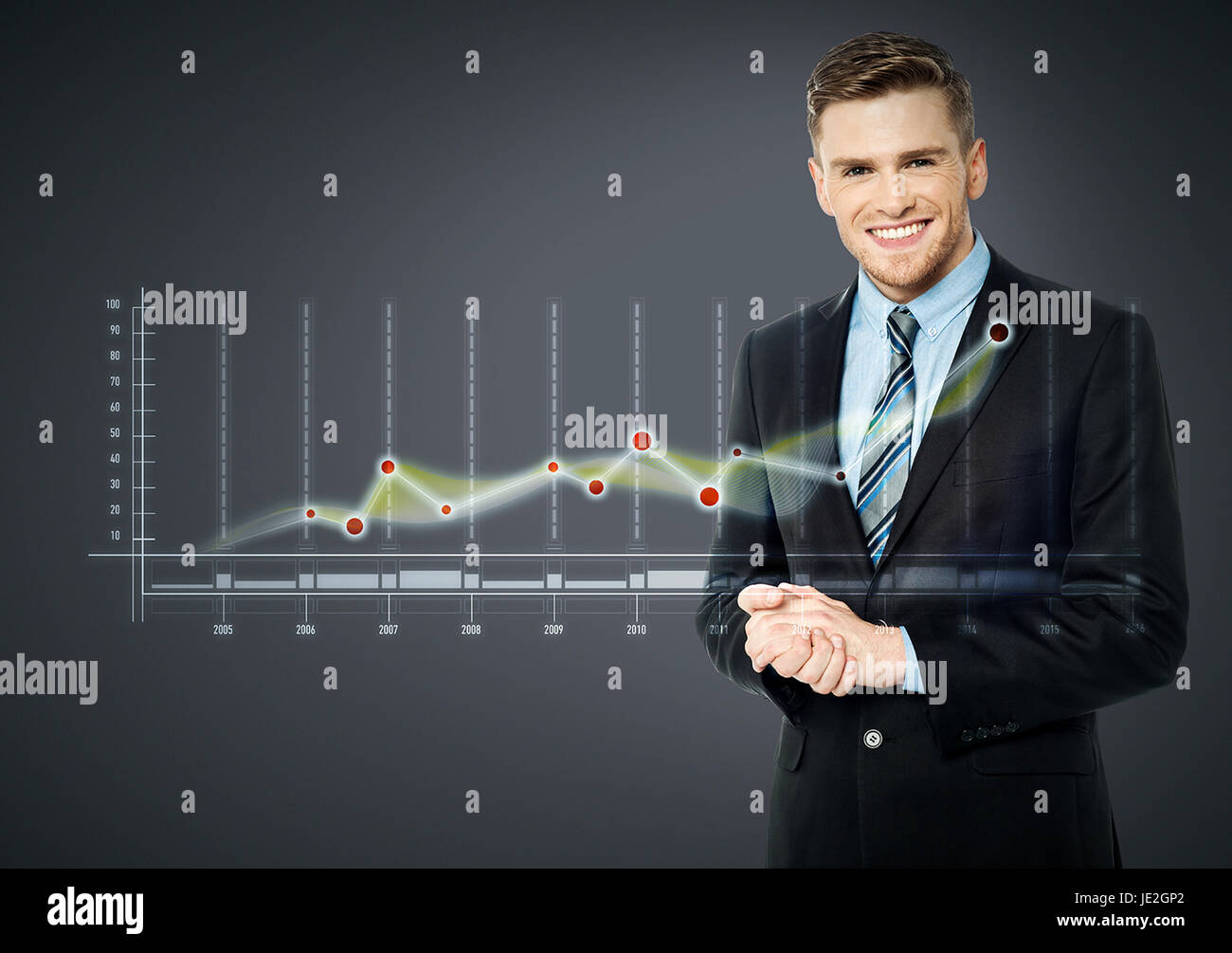 Young business man standing with digital graph report Stock Photo - Alamy