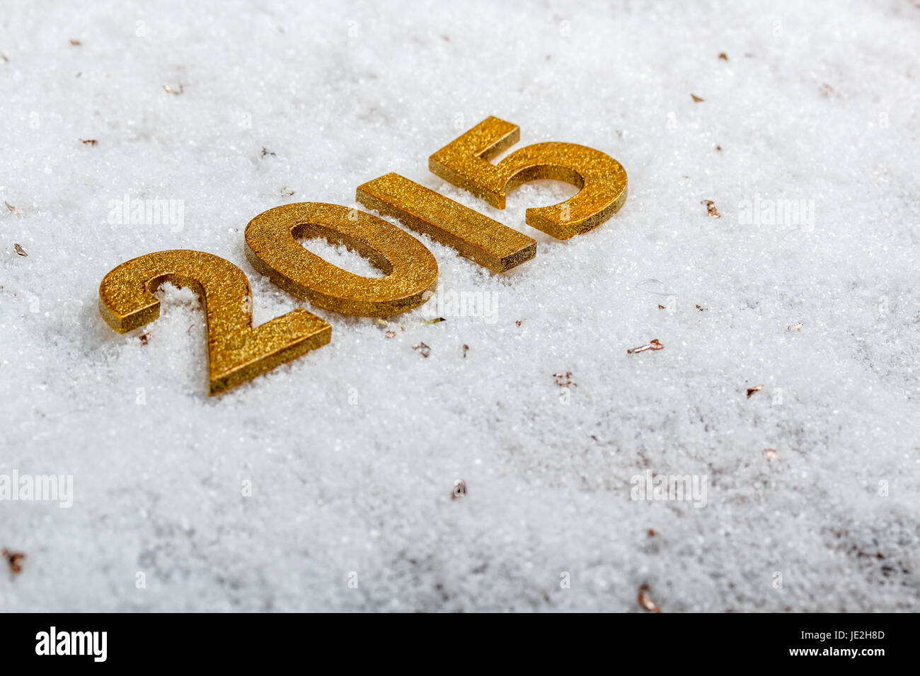 2015 year golden figures on the snow background Stock Photo - Alamy