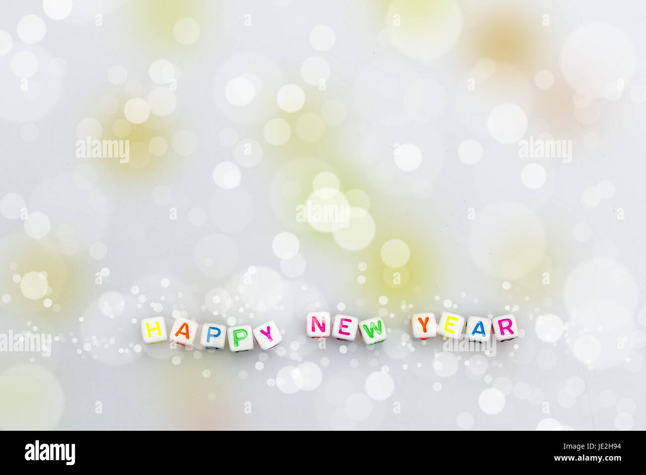 Happy New Year word formed by letter pieces Stock Photo - Alamy