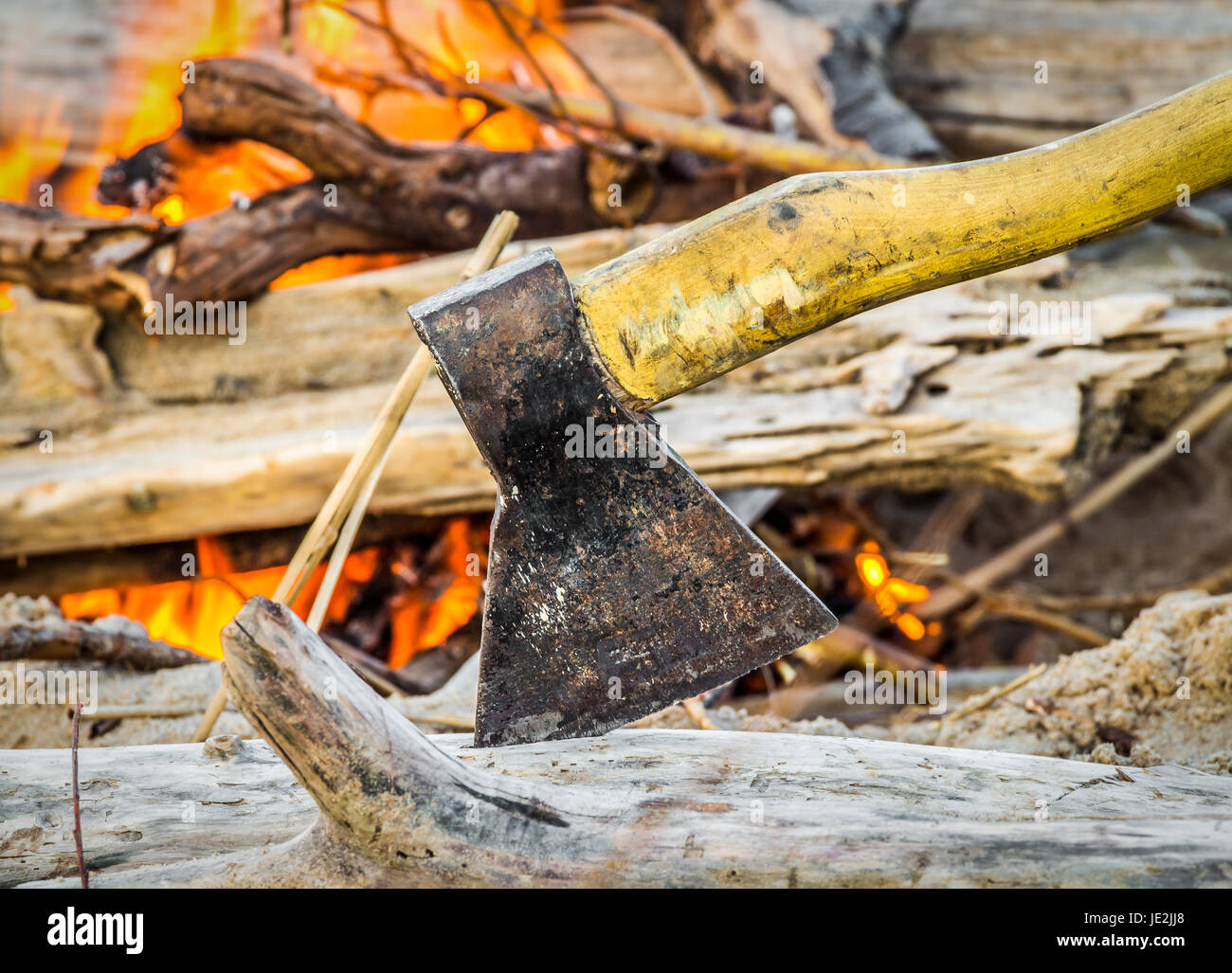 A small fire on the sandy river bank close-up Stock Photo - Alamy