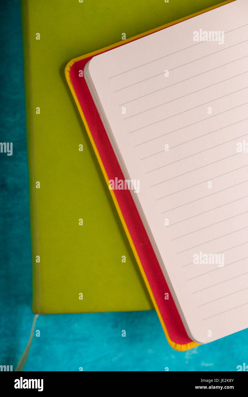 Set of notebook on the cyan background top view vertical Stock Photo ...