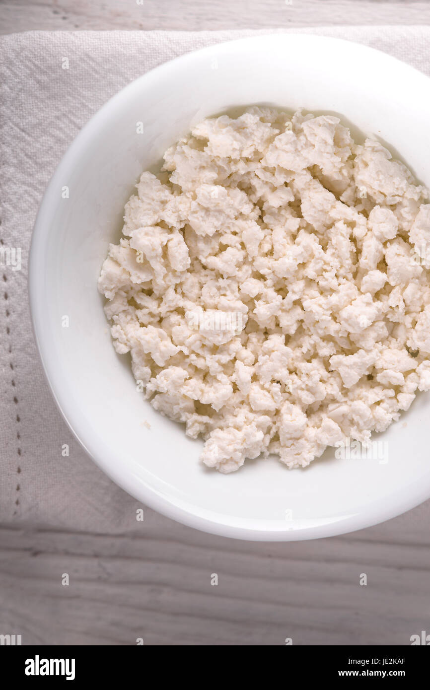 Cottage cheese in the ceramic plates on table vertical Stock Photo - Alamy