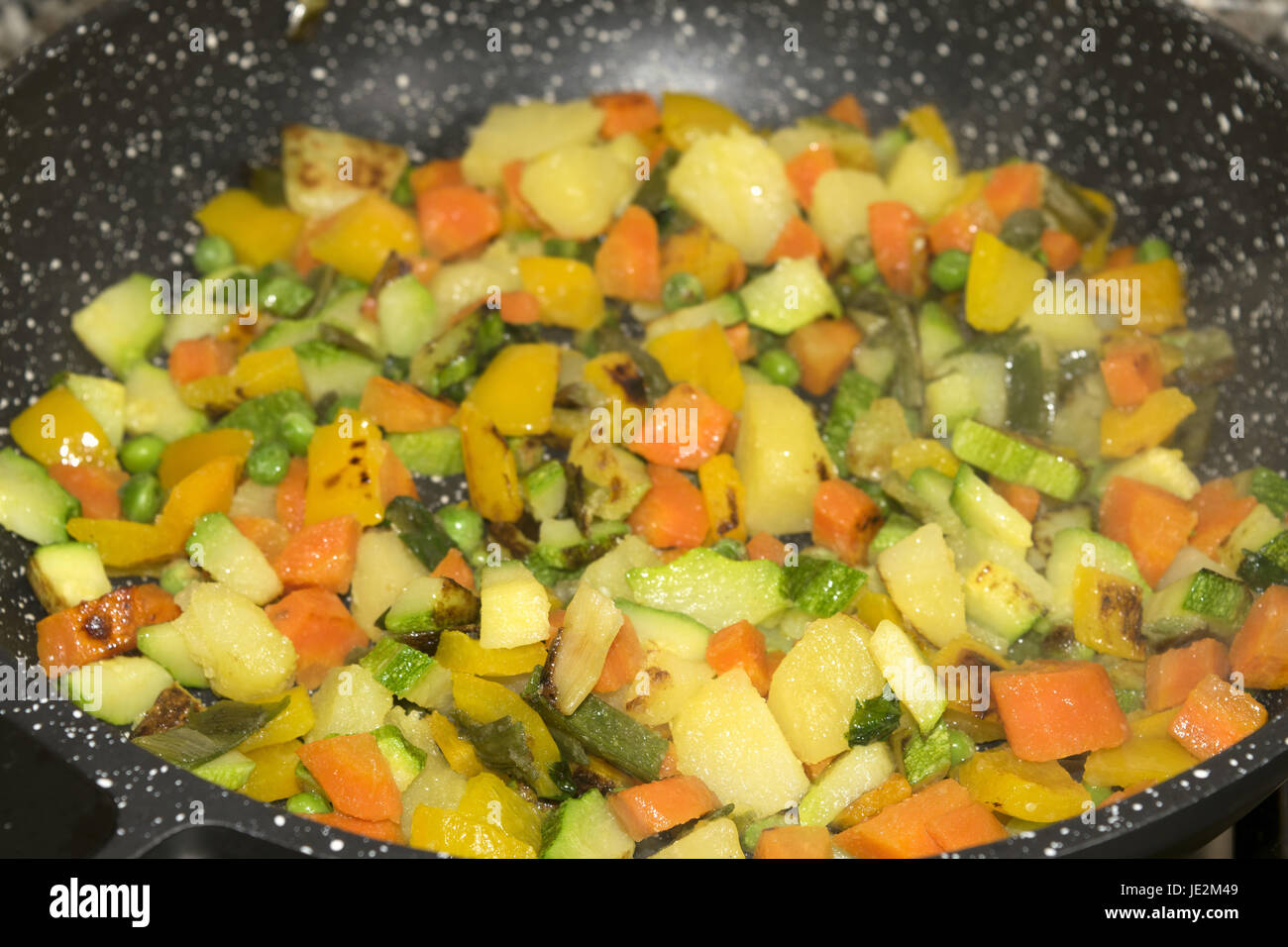 healthy flavours and flagrances:light vegetables in pan Stock Photo - Alamy