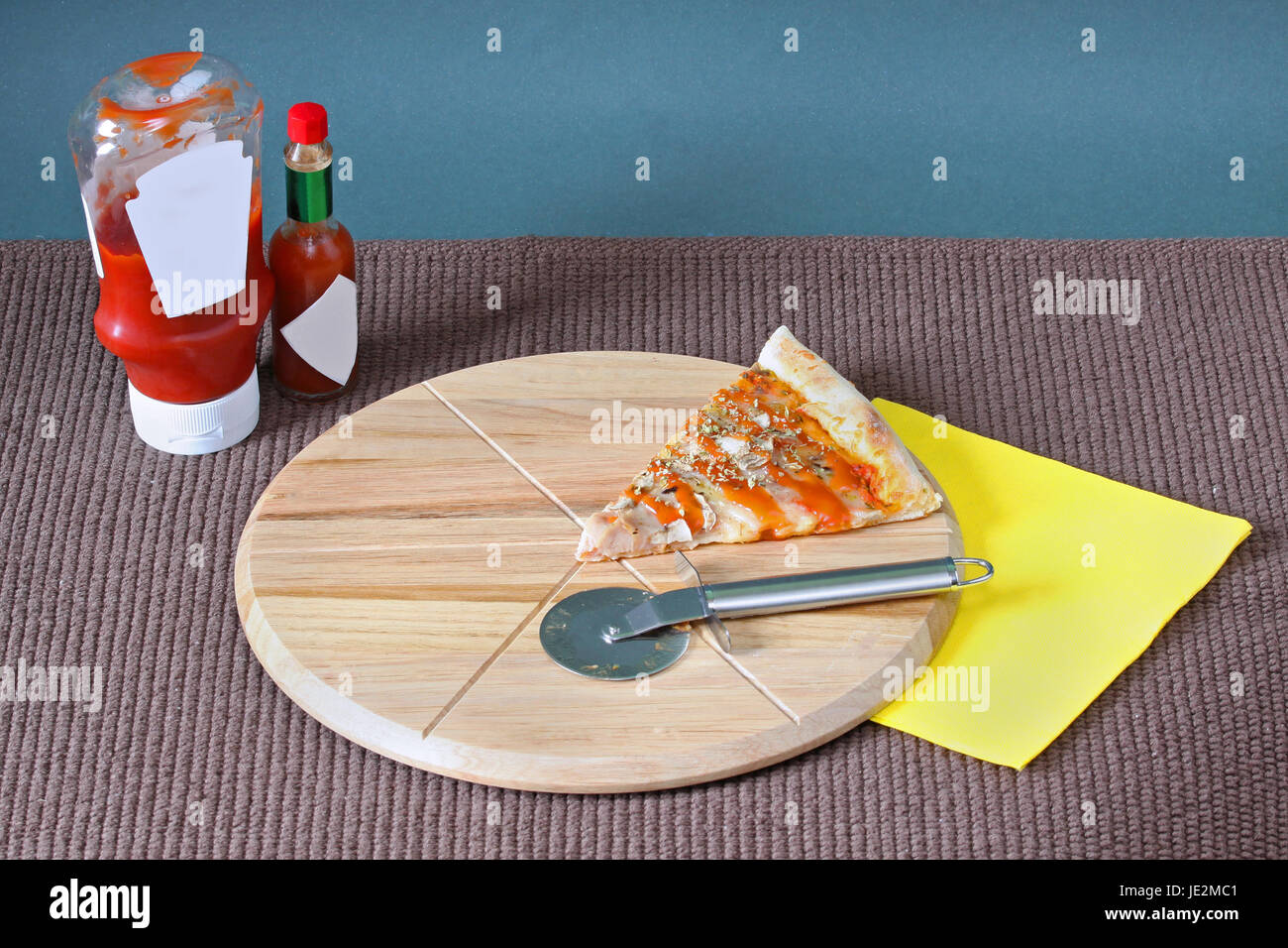 Cut out triangle of pizza on circle wooden chopping board Stock Photo ...