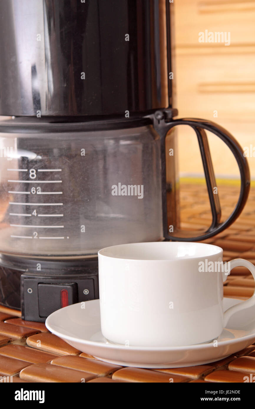 coffee machine and cup on bamboo desk Stock Photo - Alamy