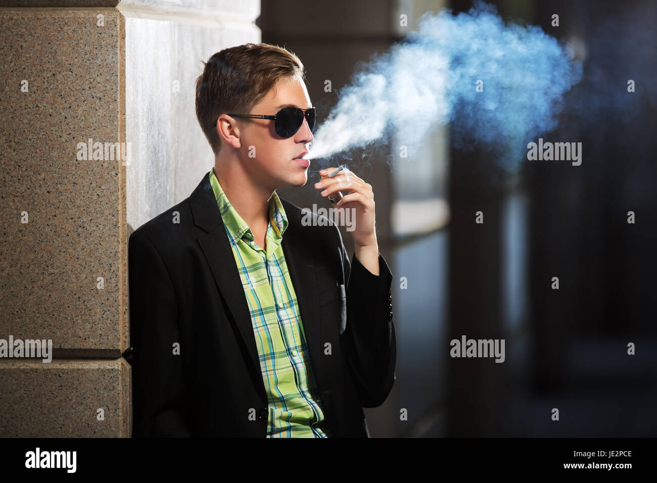 Fashion model smoking cigarette hi-res stock photography and images - Alamy