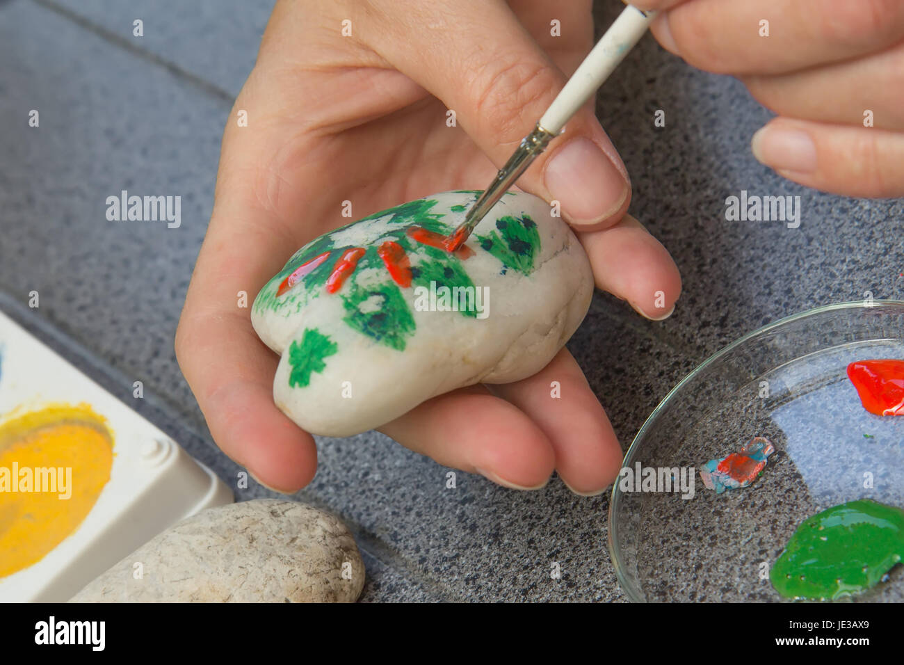 Handmade stone painting production hi-res stock photography and images ...