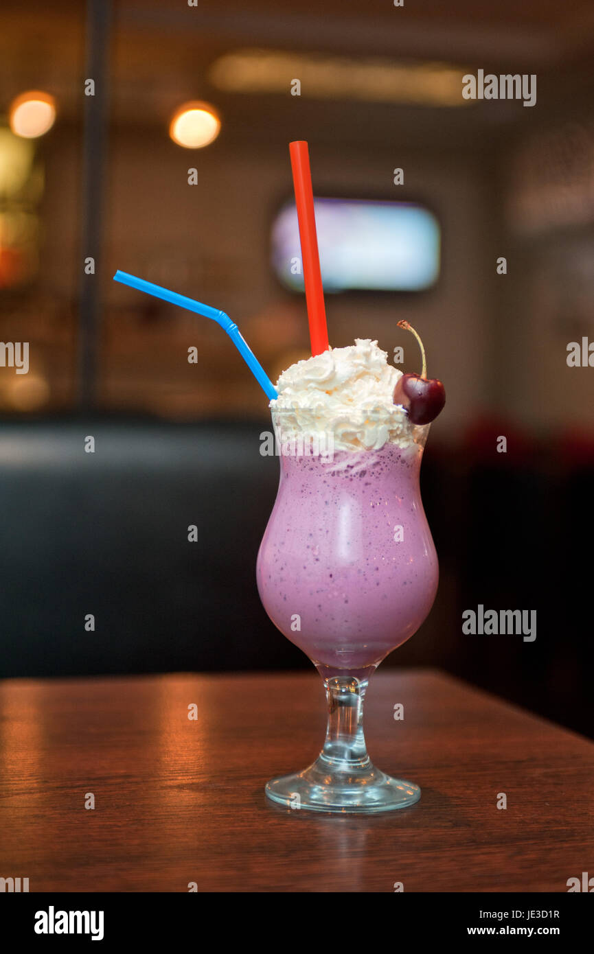 Cherry milkshake with fresh fruits Stock Photo - Alamy