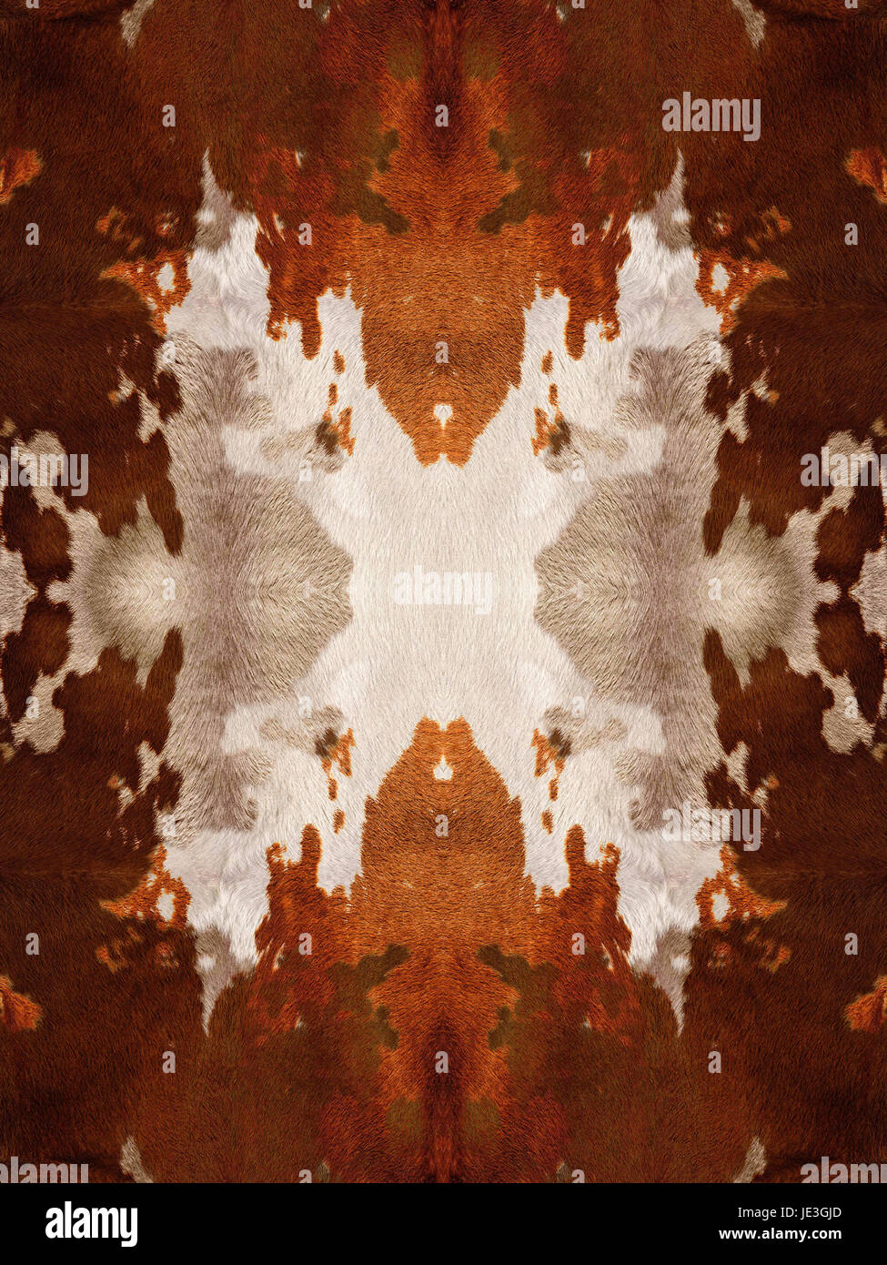 Brown and white kaleidoscope cow hide pattern Stock Photo - Alamy