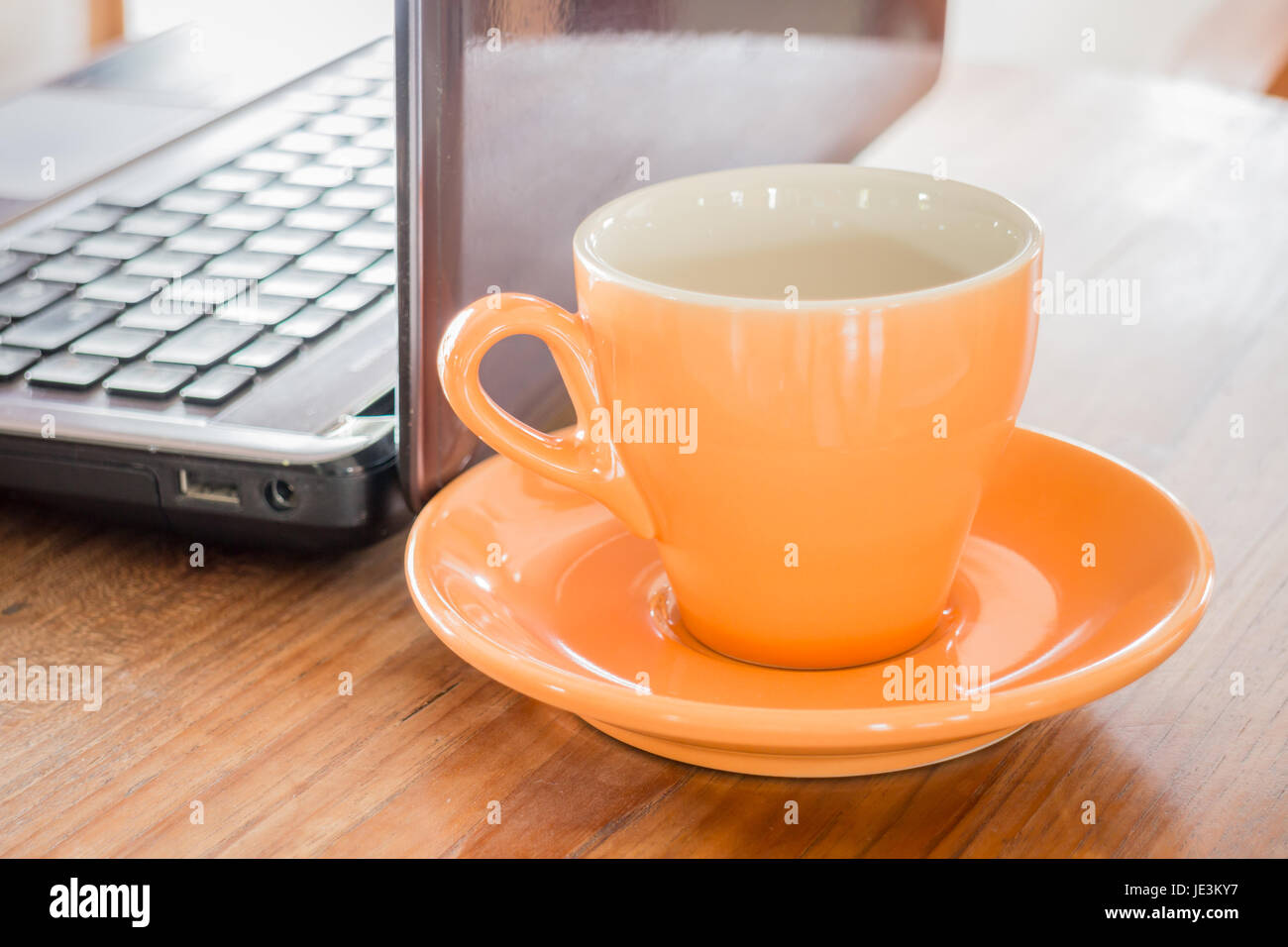 Hot cup of tea on work table, stock photo Stock Photo - Alamy