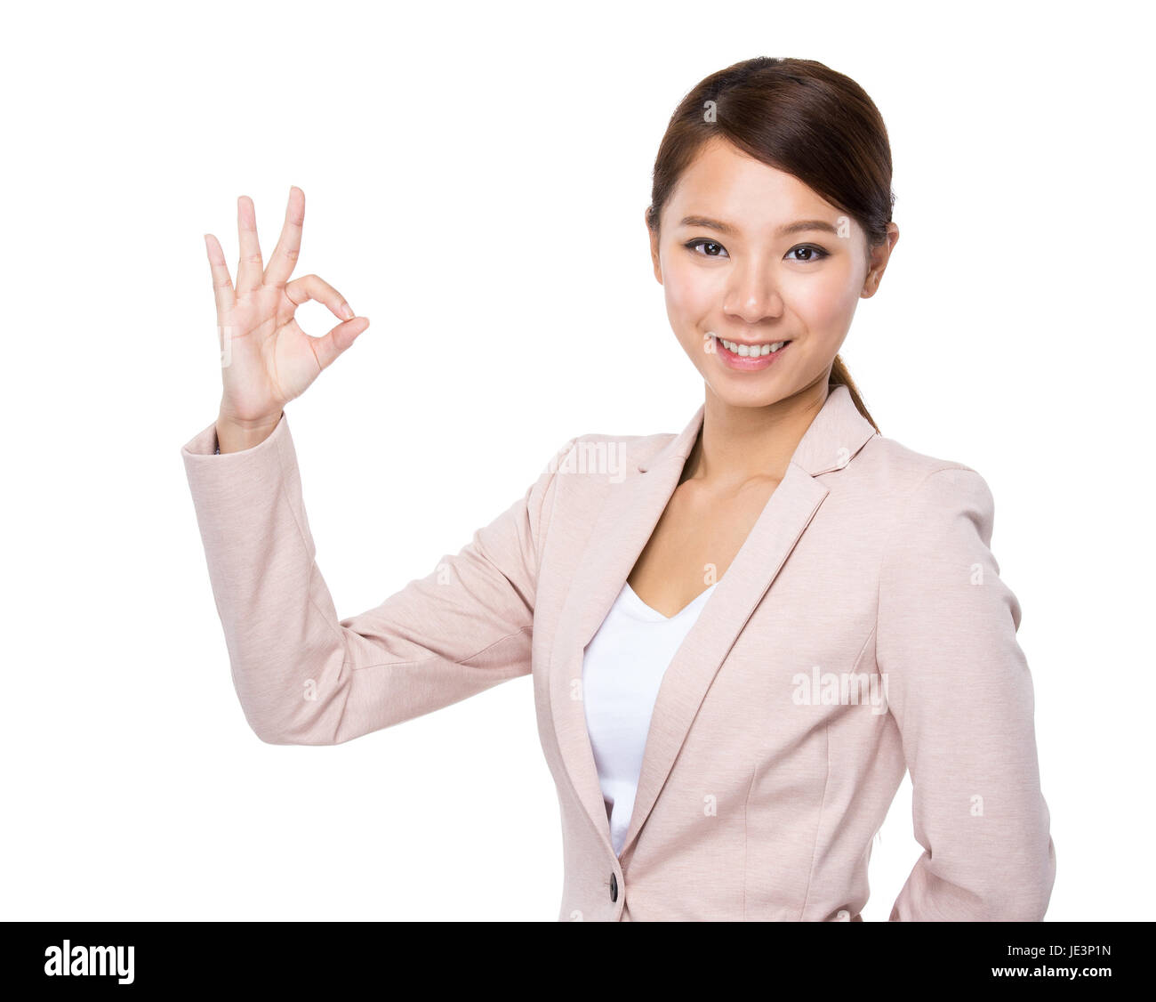 Businesswoman with ok sign Stock Photo - Alamy