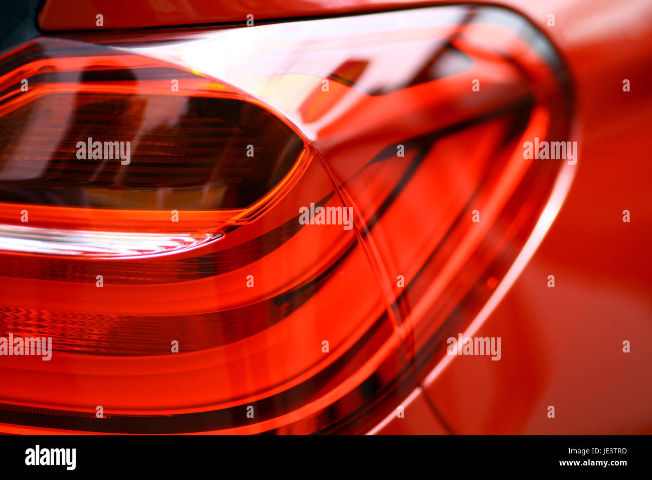 Detail on the rear light of a red car Stock Photo - Alamy