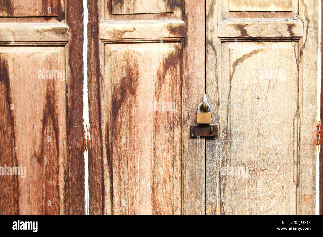 Lock on old wooden door Stock Photo - Alamy