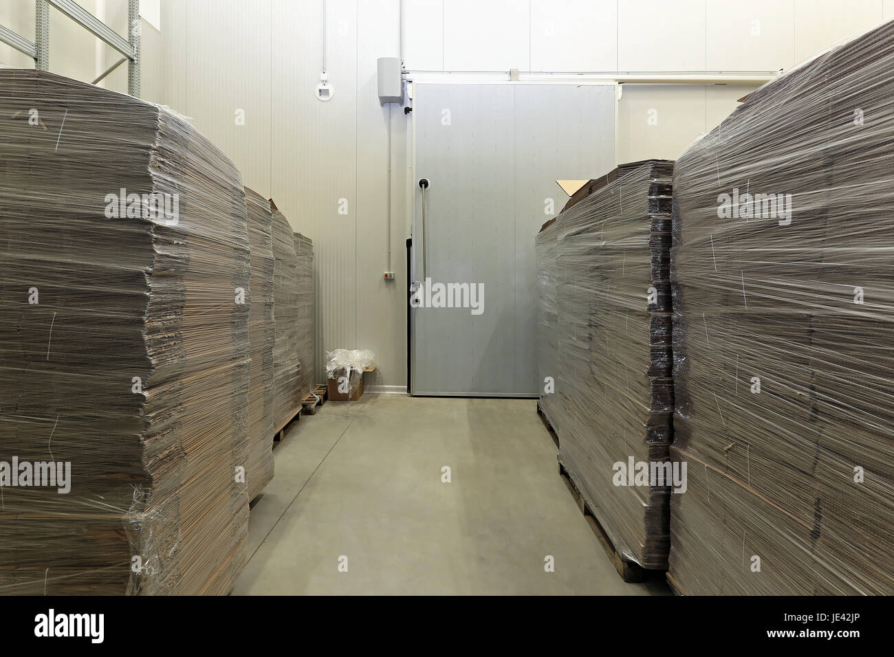 Cardboard boxes packaging material in storage room Stock Photo - Alamy