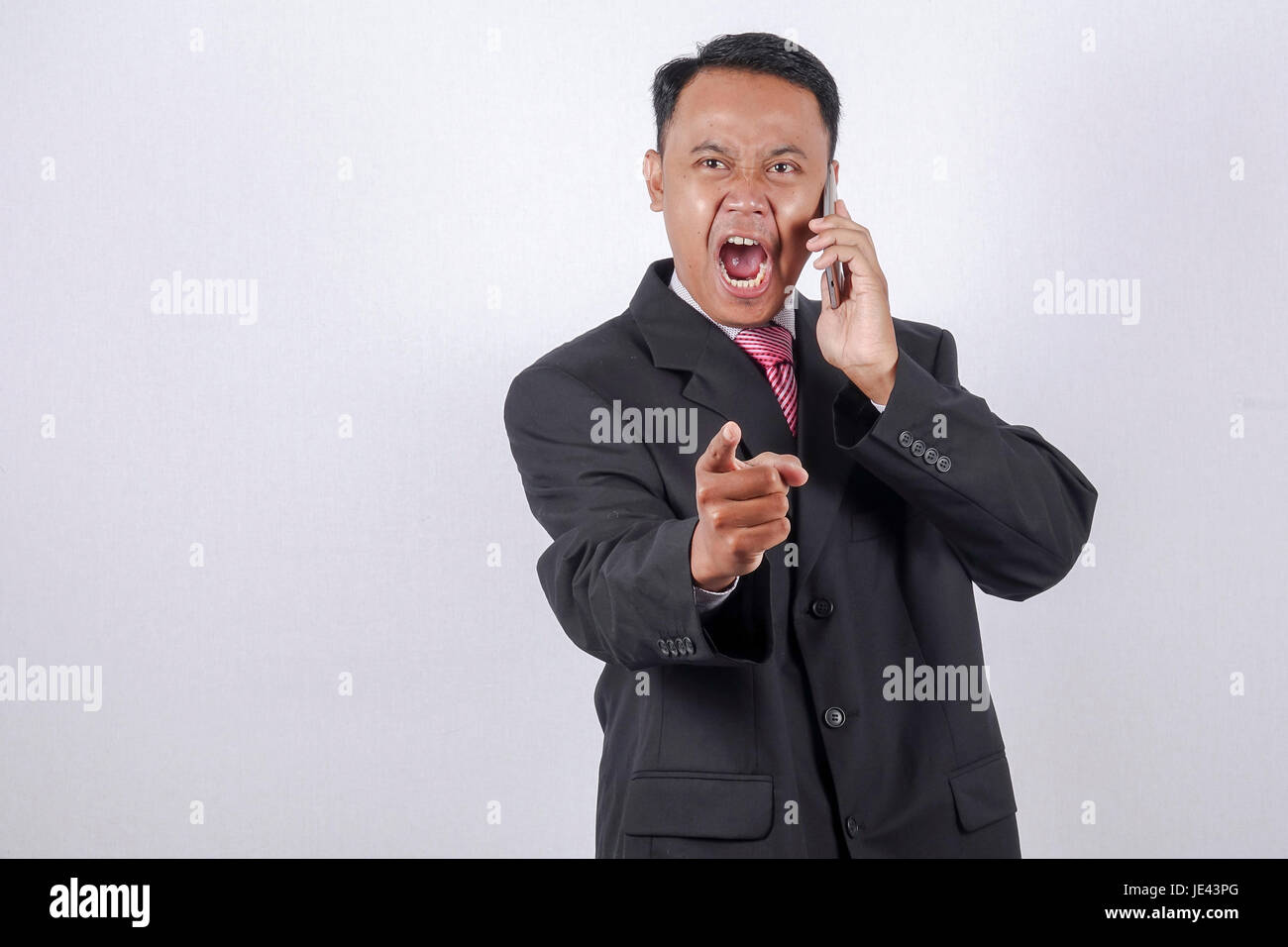 Young Business Man Speaking mobile phone, isolated on white background ...