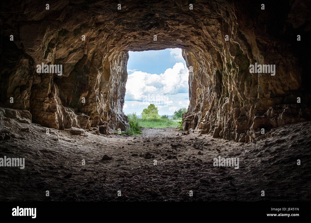 Entrance to an abandoned karst cave closeup Stock Photo - Alamy