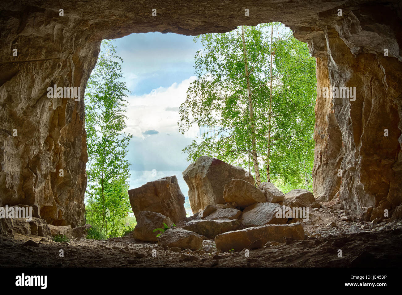 Entrance to an abandoned karst cave closeup Stock Photo - Alamy