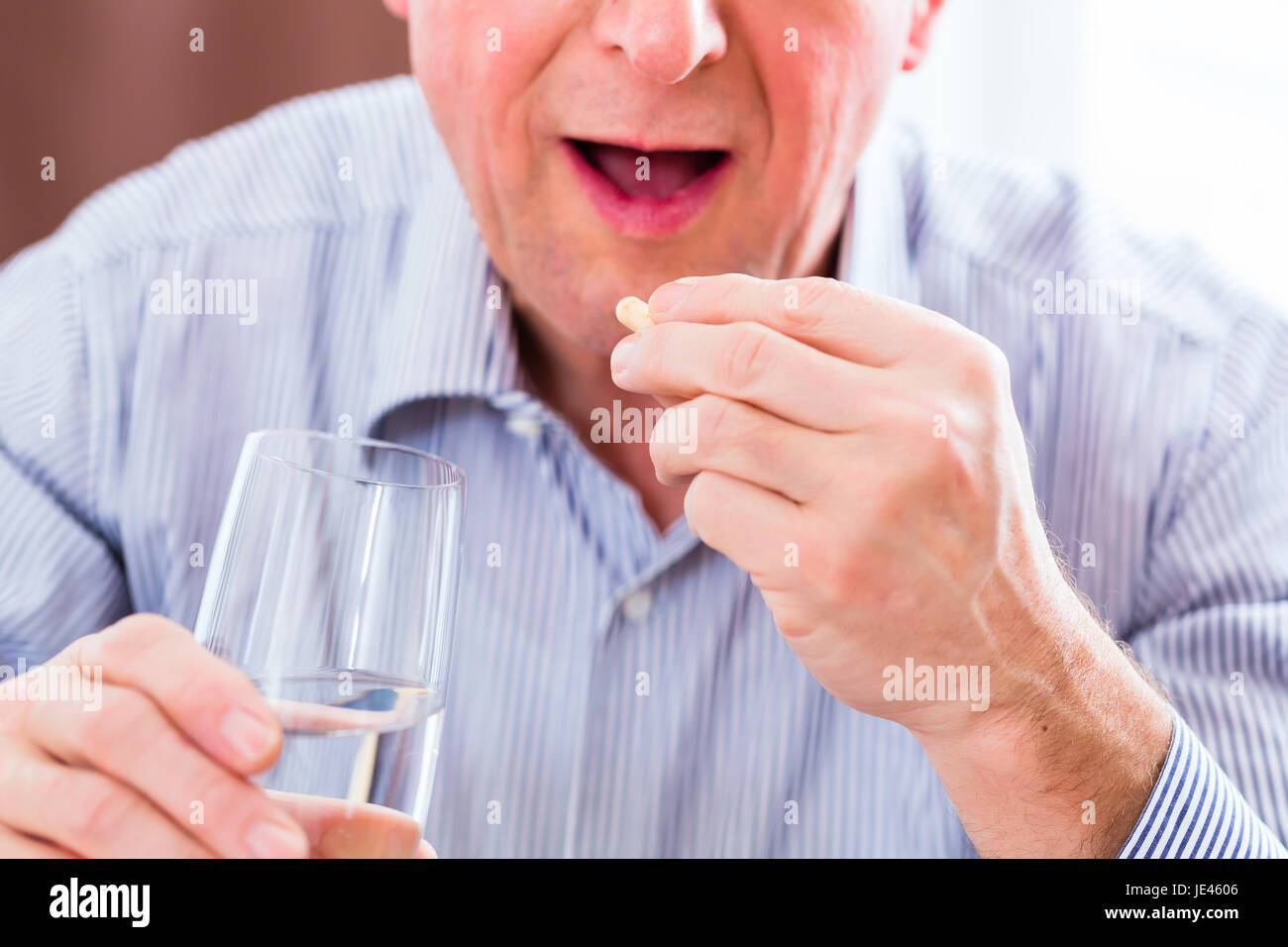 Old man taking medicaments home hi-res stock photography and images - Alamy