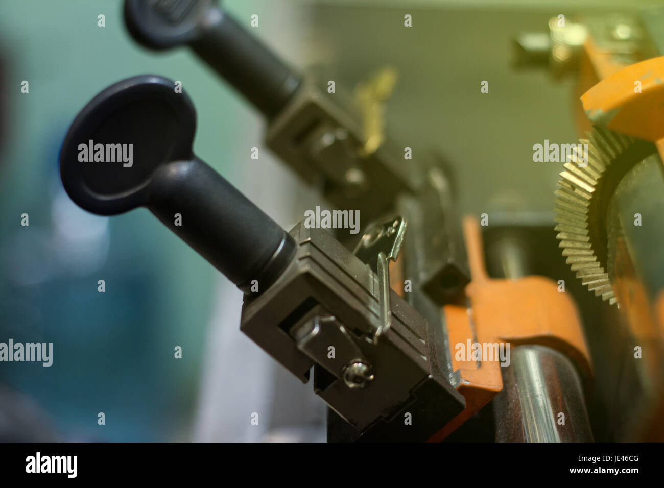 Machine production of duplicate metal keys. The key of the yellow metal ...