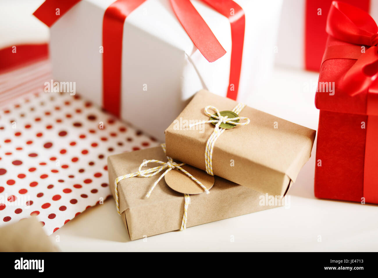 Red, white and earthy colored gift boxes Stock Photo - Alamy