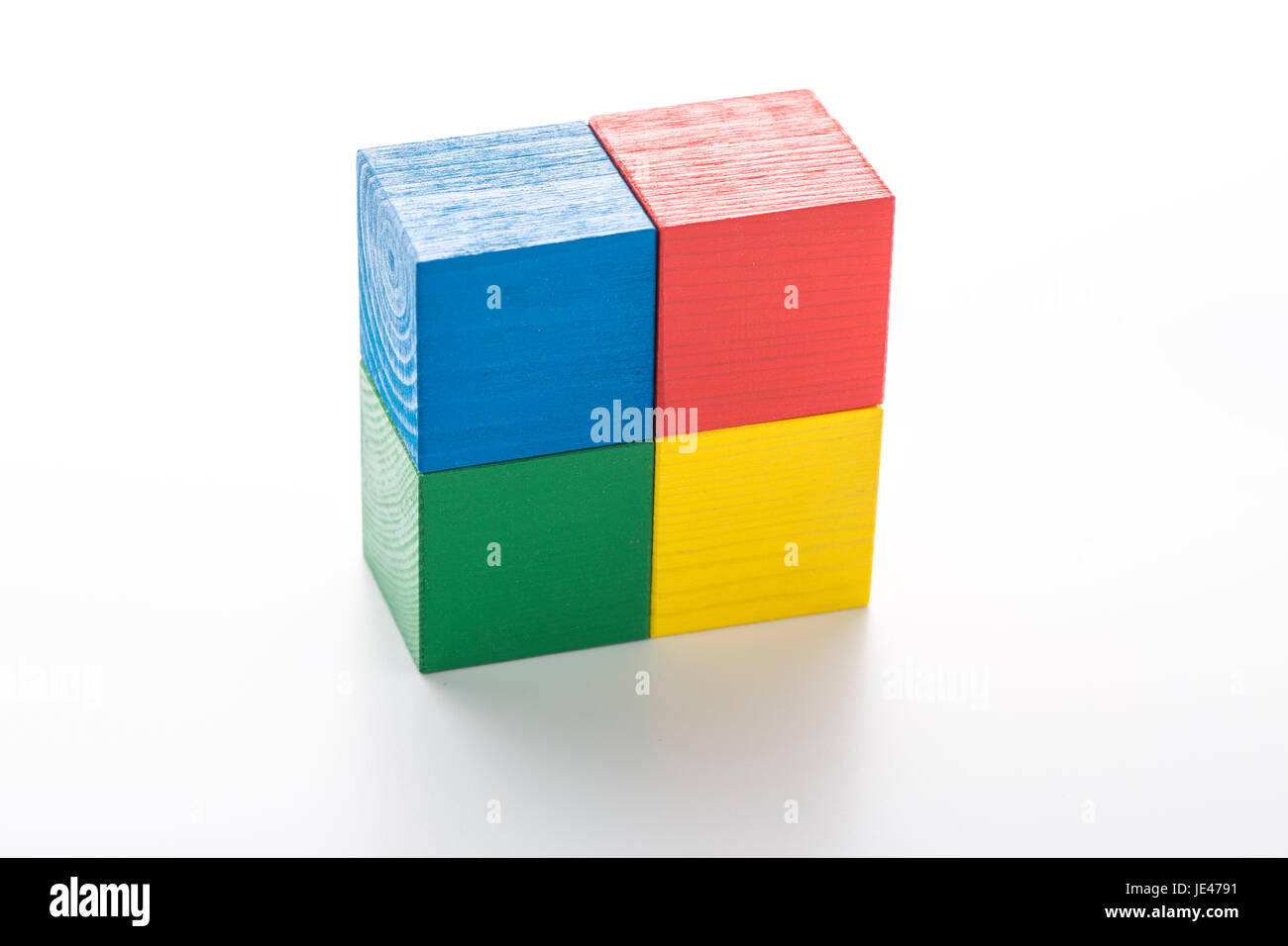 Stack of four colorful cubes isolated on white background Stock Photo ...