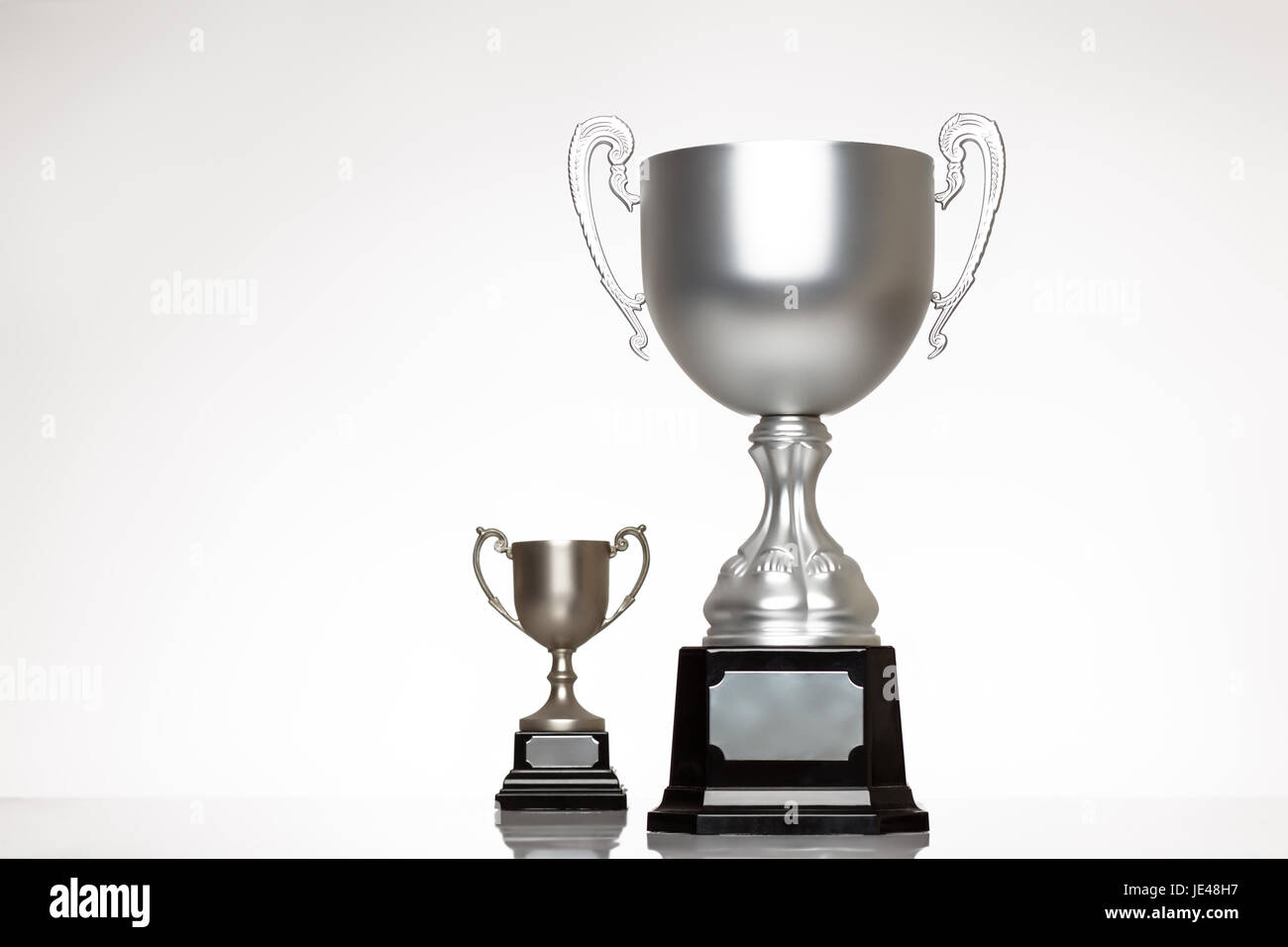 still life image of two trophies shot in the studio one large and one ...