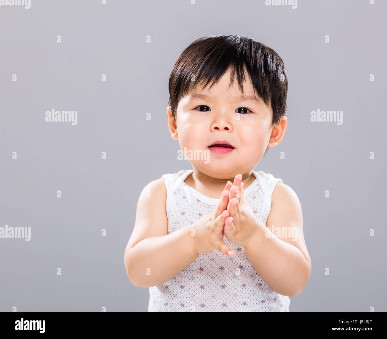Baby clapping joy expression hi-res stock photography and images - Alamy