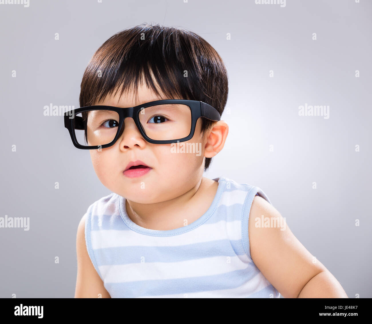 Little boy with glasses Stock Photo - Alamy