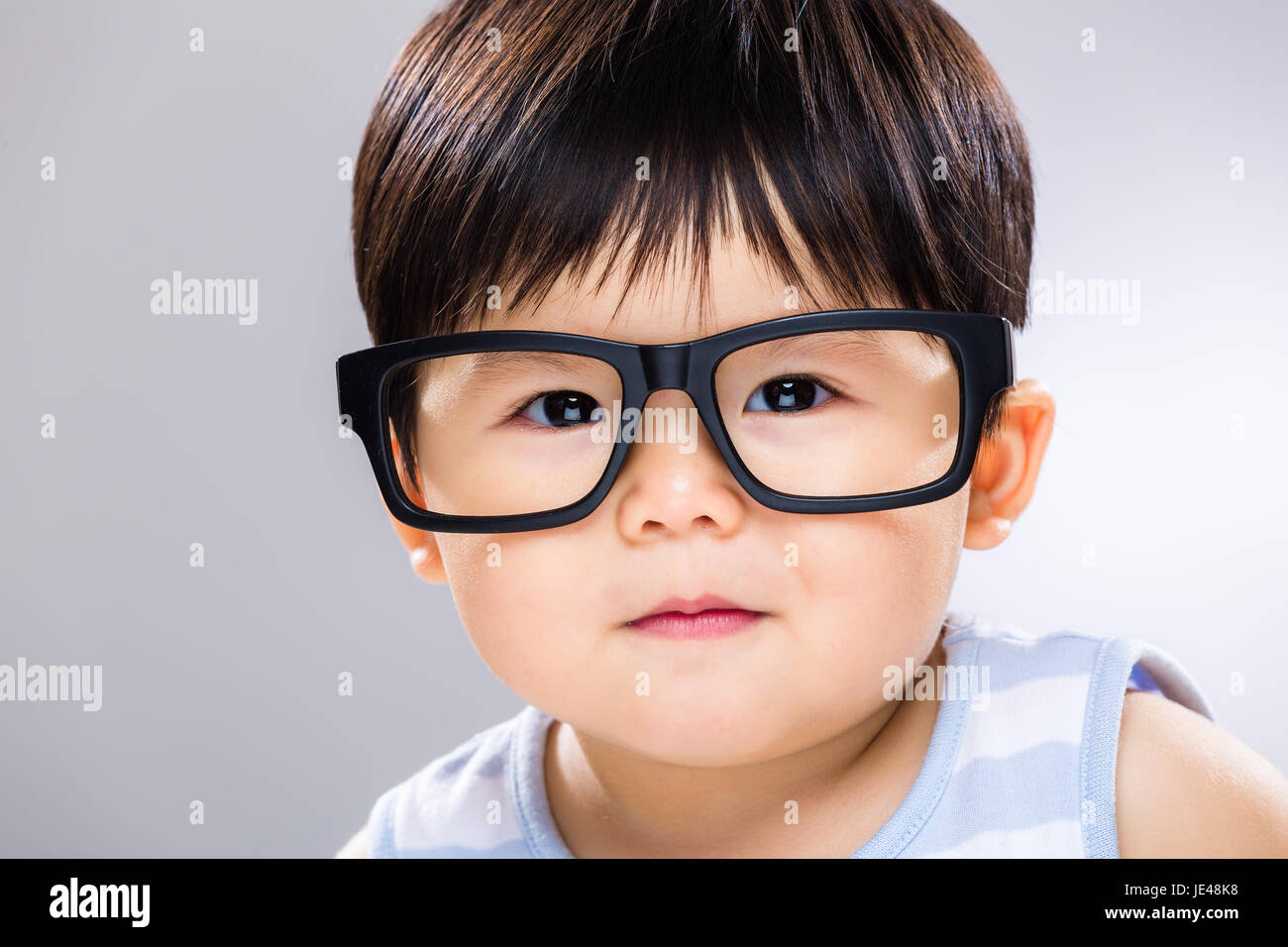 Smart baby with glasses Stock Photo - Alamy