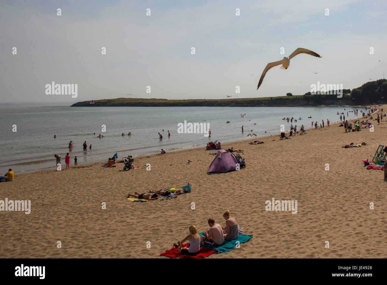 Barry Island, Wales, UK. 20th June 2017. People bask in record breaking ...