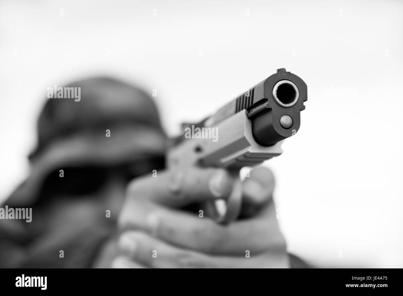 Man criminal gun in hand Black and White Stock Photos & Images - Alamy