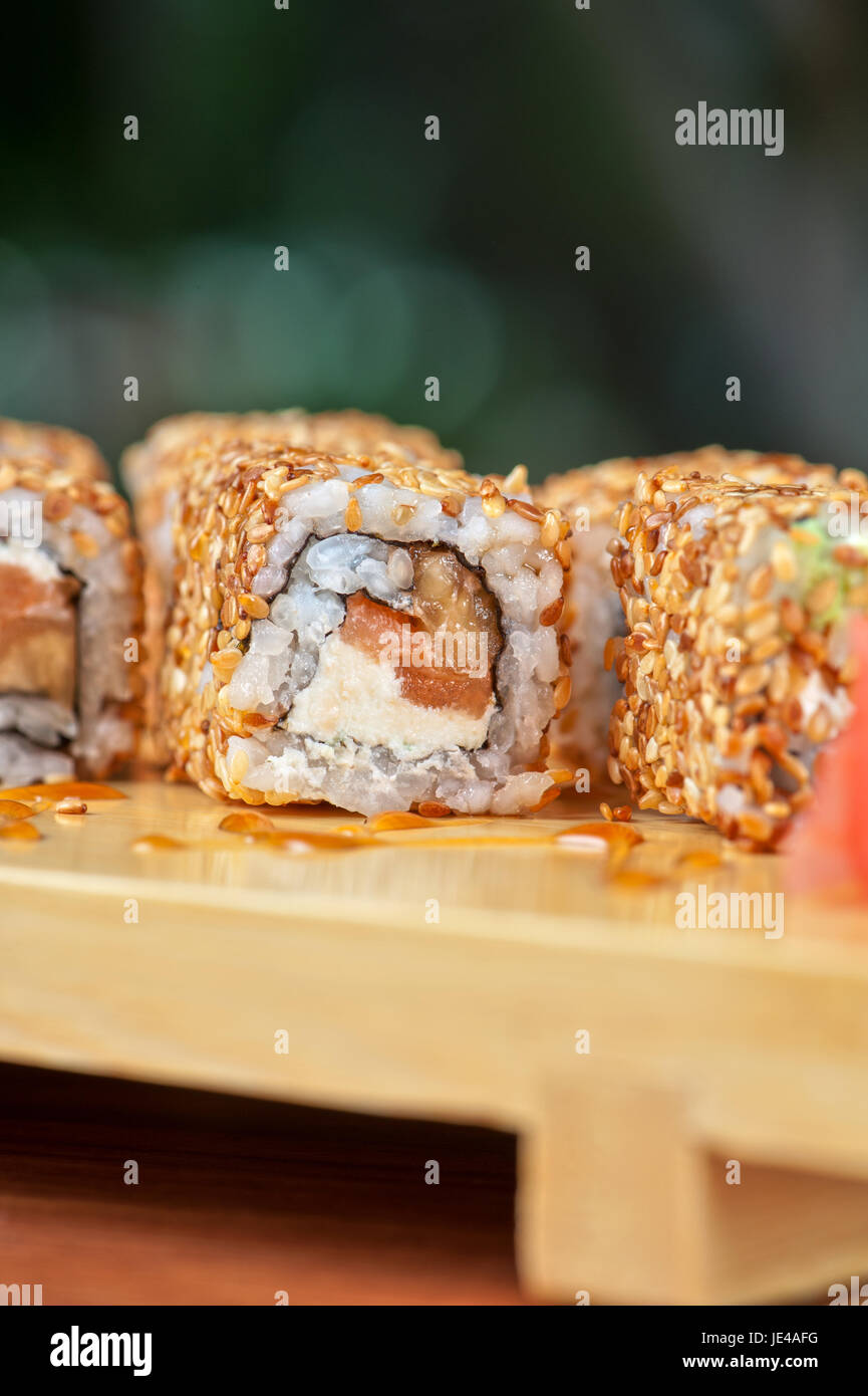 Japanese cuisine - sesame sushi rolls with syrup Stock Photo - Alamy