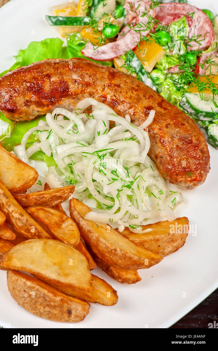 Roasted sausage with vegetables closeup Stock Photo - Alamy