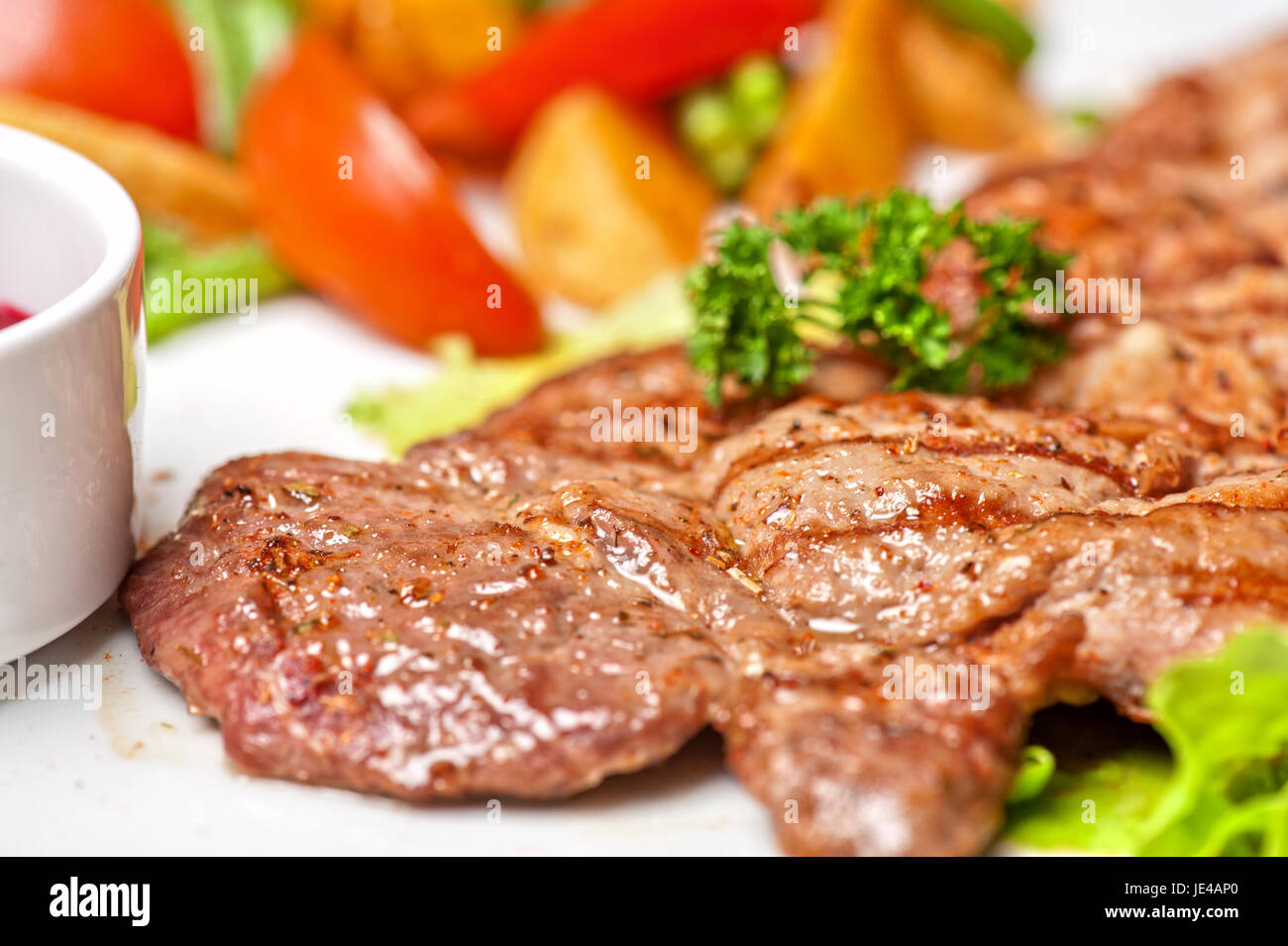 Beef chop with vegetable and sauce Stock Photo - Alamy