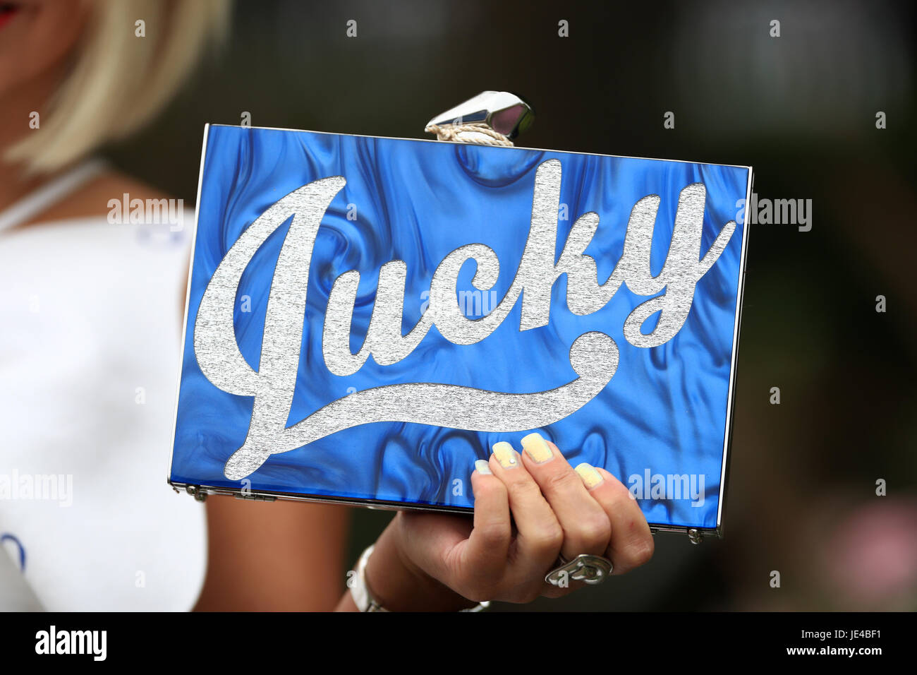 Sharon Teague from Derbyshire holds up her 'lucky' clutchbag during day ...