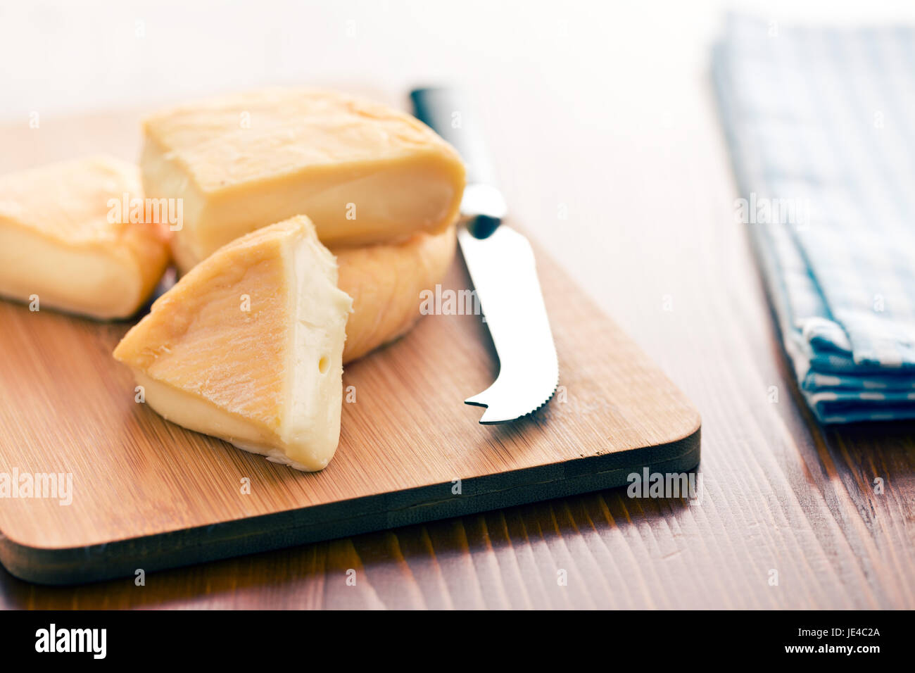 the french cheese on cutting board Stock Photo - Alamy