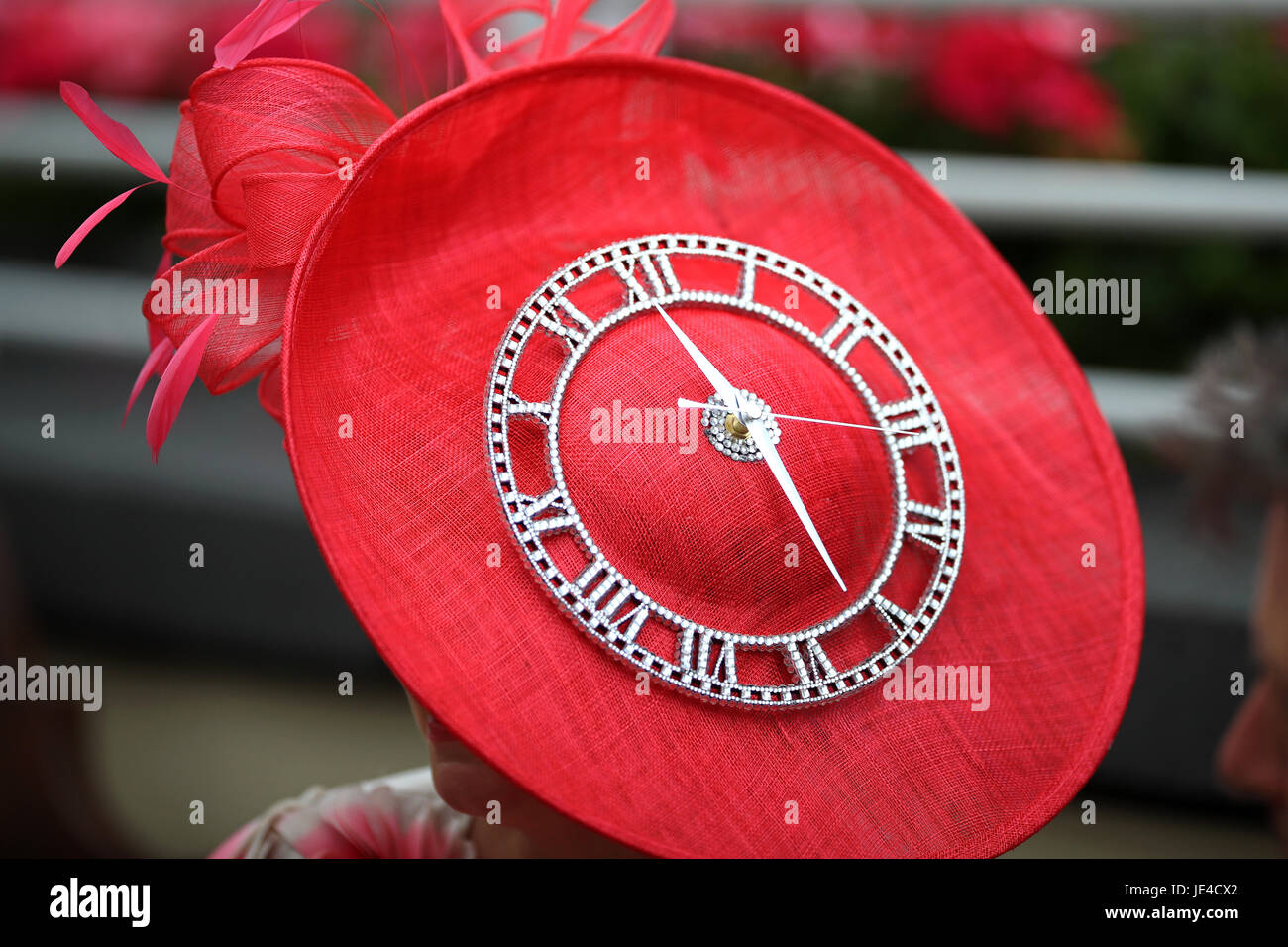 A female racegoer sports a clock themed hat during day three of Royal ...